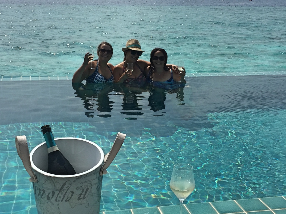 Drinking sparkling wine in Charlotte's pool! - Free Two Roam
