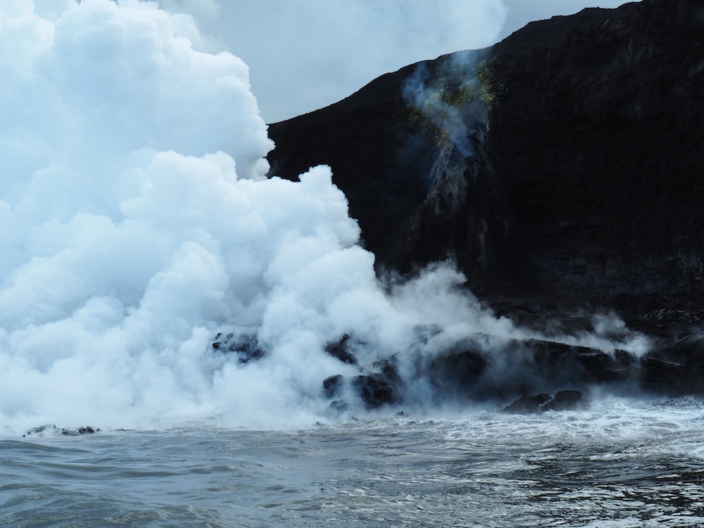 Steam from the lava hitting the water. - Free Two Roam